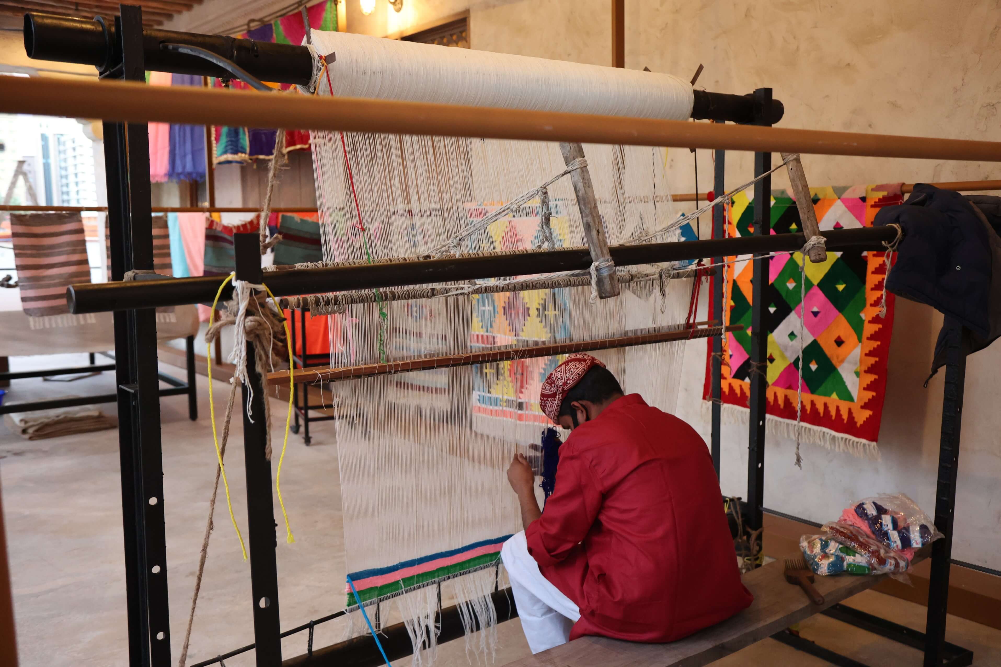 Weaver Operating a Dari Loom, Crafting Colorful Intricate Textiles at ...